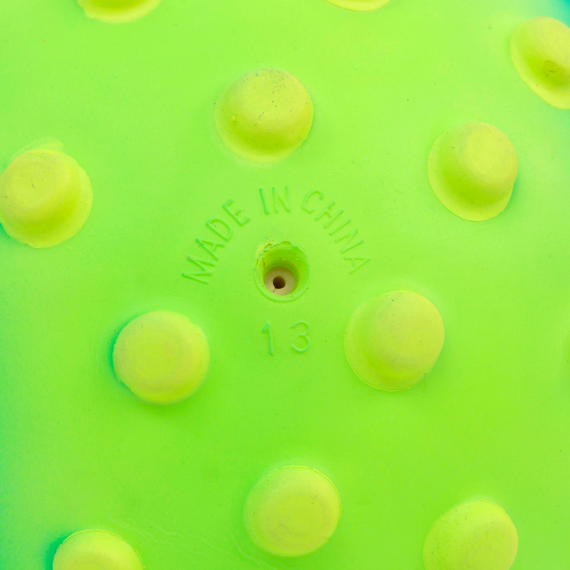 Green small learning to swim ball with yellow dots