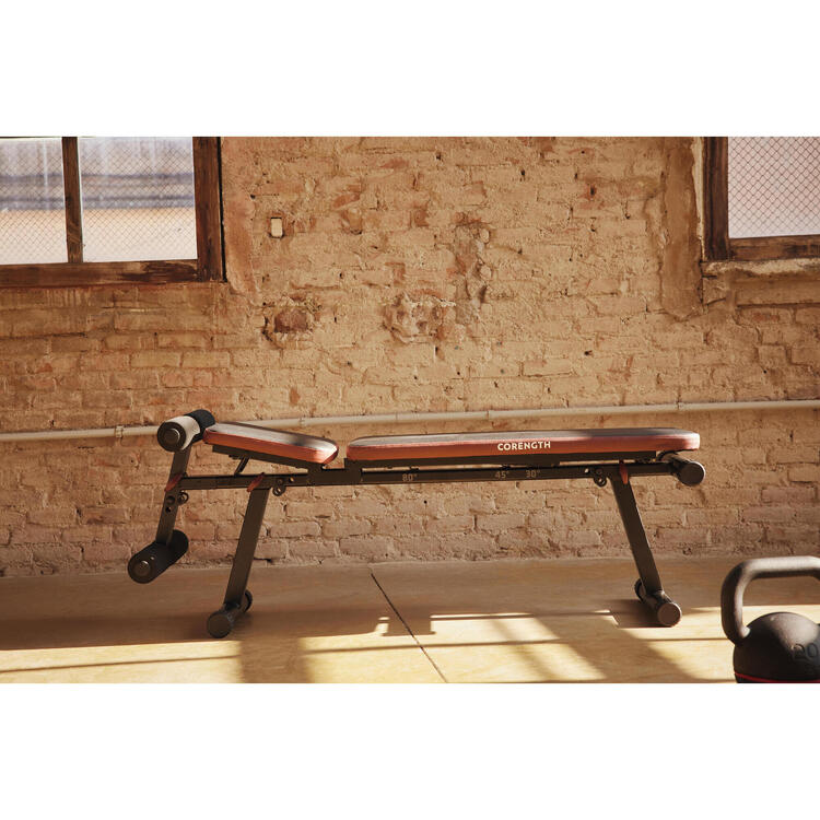 Robust and compact fold-down incline weight bench with leg bar