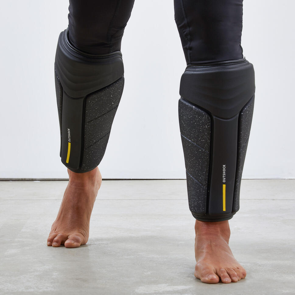 PROTEGE-TIBIAS ERGONOMIQUES 500 - NOIRS OUTSHOCK | Decathlon